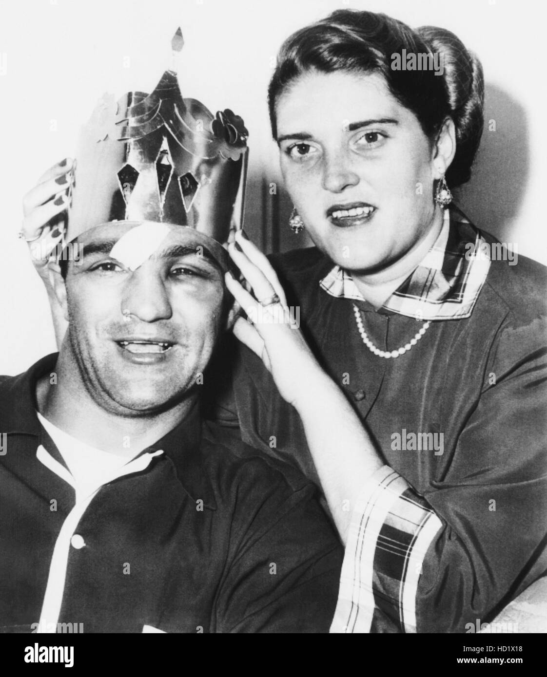 Boxer Rocky Marciano, left, being crowned by his wife, Barbara Marciano ...