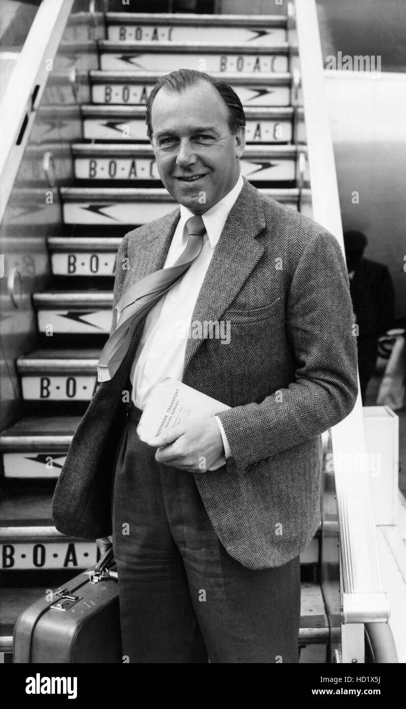 Film director Ronald Neame arriving in London, 1955 Stock Photo - Alamy