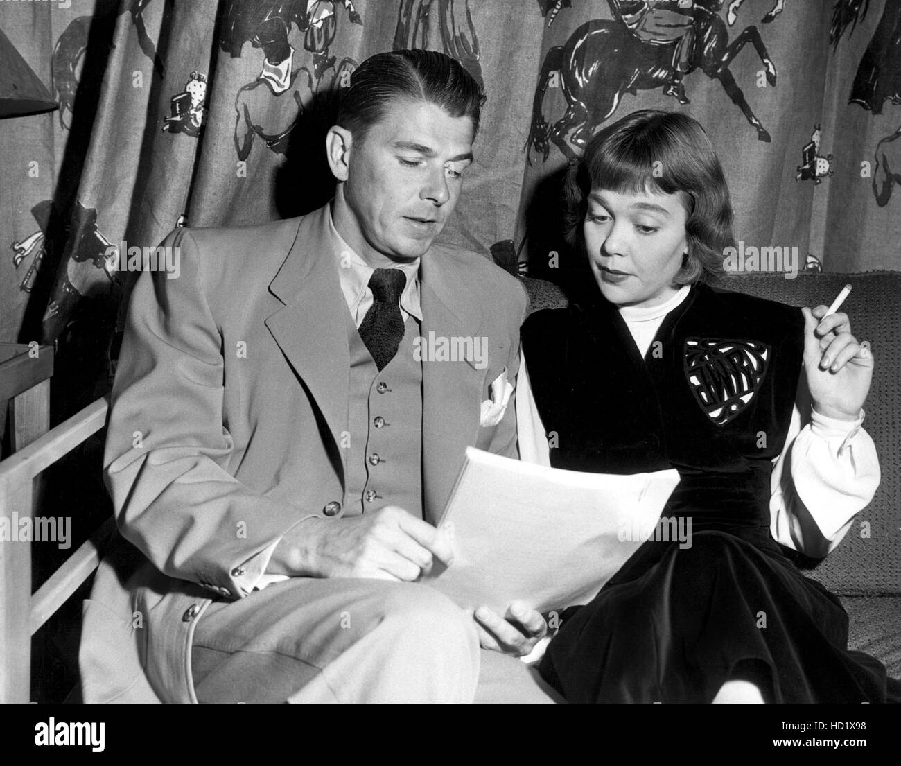 RONALD REAGAN and wife JANE WYMAN review script for an episode of LUX ...