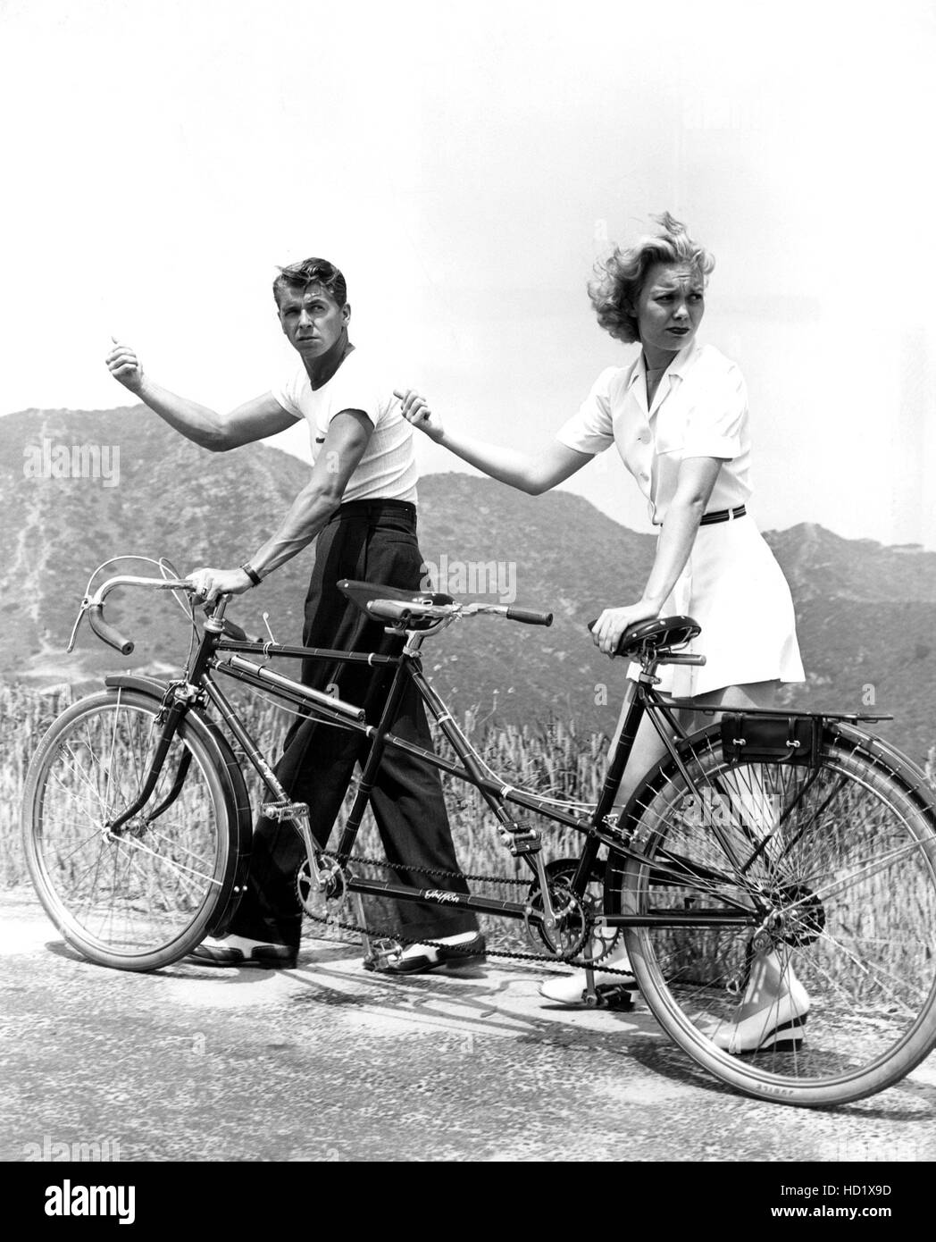 Tired of riding their tandem, newlyweds RONALD REAGAN and JANE WYMAN ...