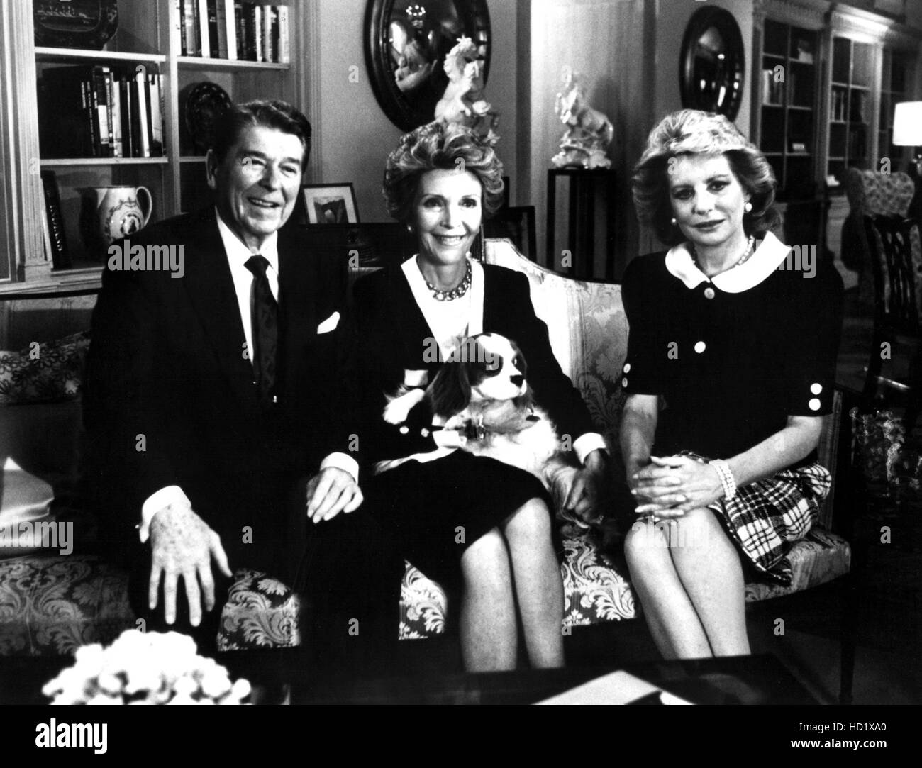 President Ronald Reagan, Nancy Reagan with Rex onher lap, Barbara ...