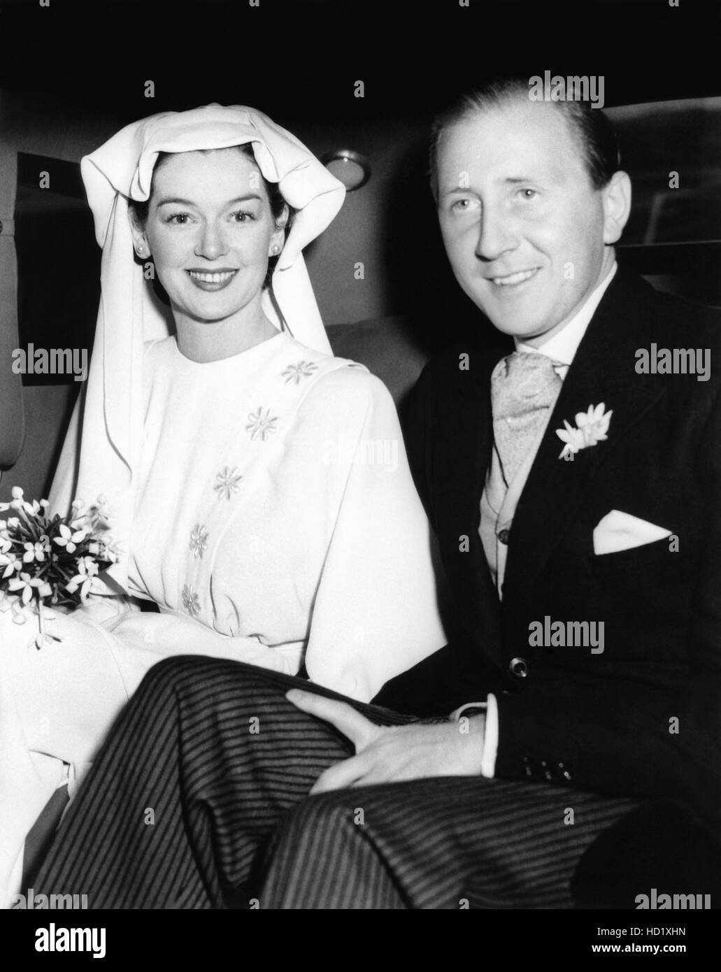 From left: Newlyweds Rosalind Russell and Fred Brisson, sitting in ...