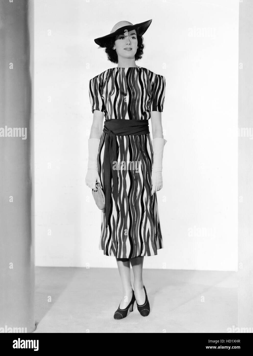 Rosalind Russell wearing a multi-color crepe dress, MGM portrait, ca ...
