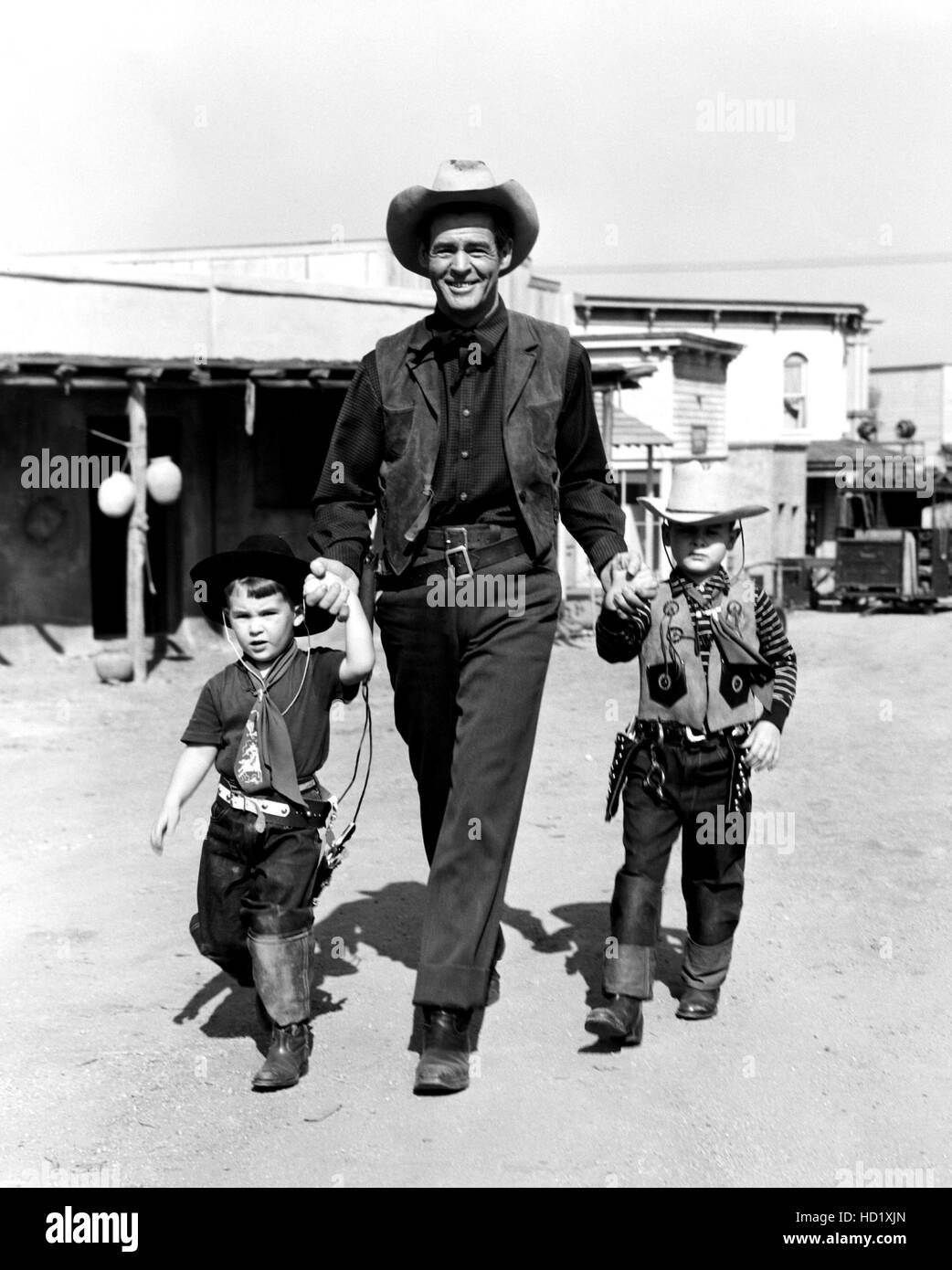 From left: Cheyney Ryan touring the Universal lot with his father ...