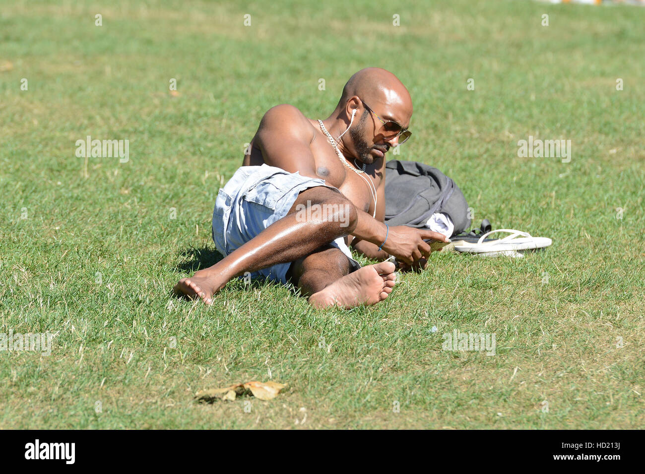 As the August bank holiday approaches sun bathers in Green Park, London ...