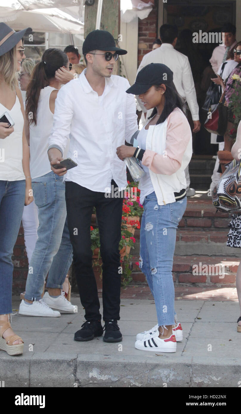 Christina Milian poses for a selfie with a fan as she arrives at The ...