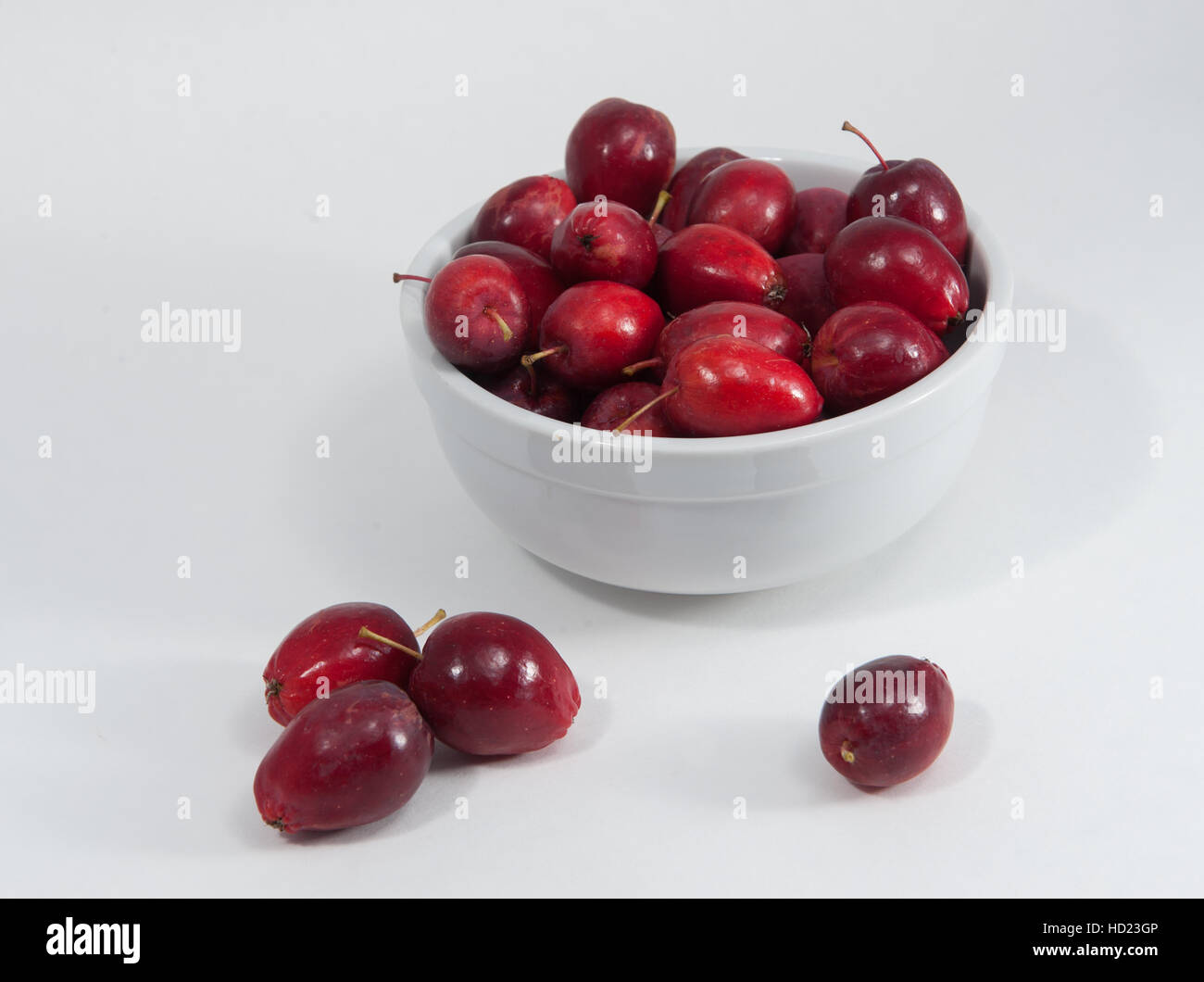 Bowl of Crab Apples "Dolgo" in a bowl against a white background Stock ...