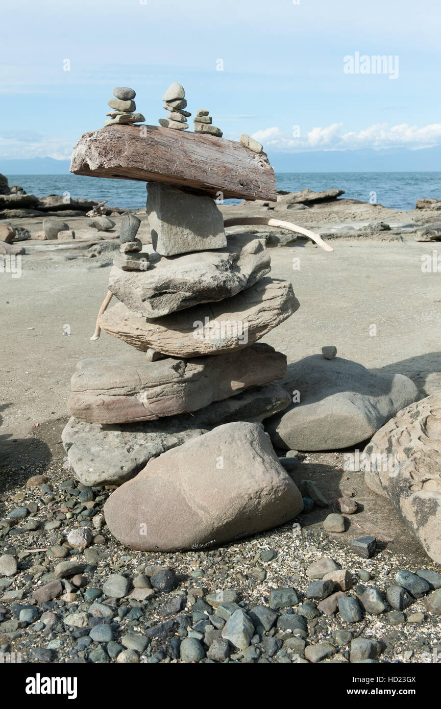 Rocks made into an Inukchuk (Inukshuk, Inuksuk) on beach at Orlebar ...