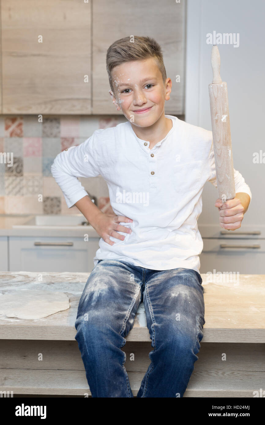 Cute adorable little boy in the kitchen Stock Photo - Alamy