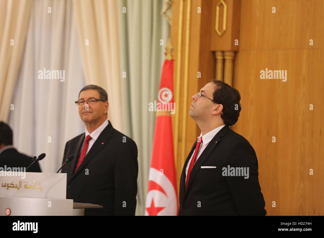 Tunisia's Prime Minister Youssef Chahed (r) with Habib Essid during the ...