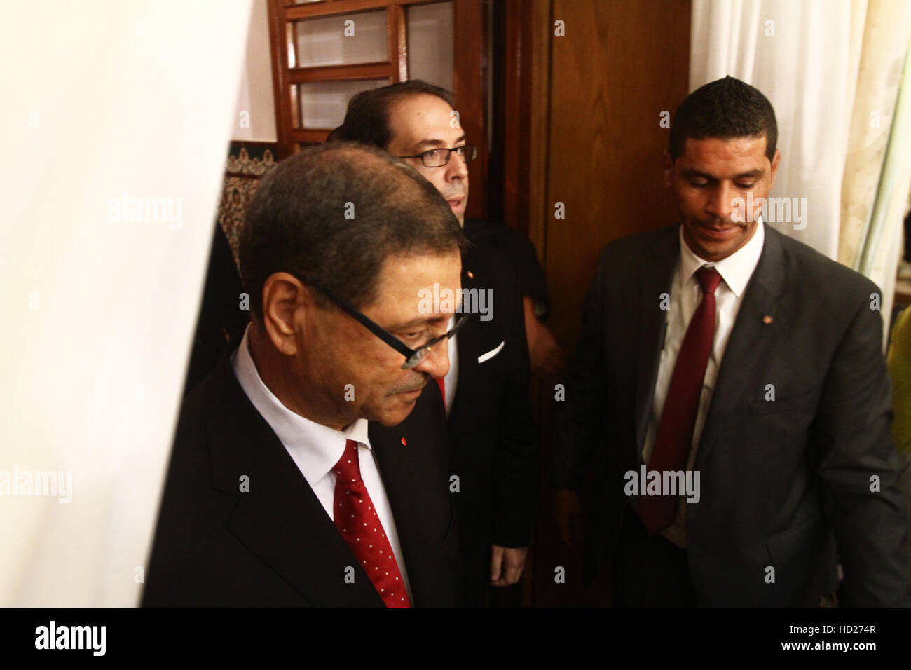 Tunisia's Prime Minister Youssef Chahed (r) with Habib Essid during the ...