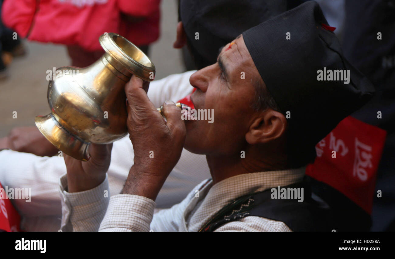 Kirtipur, Nepal. 09th Dec, 2016. A Hindu devotee drinks water from a ...