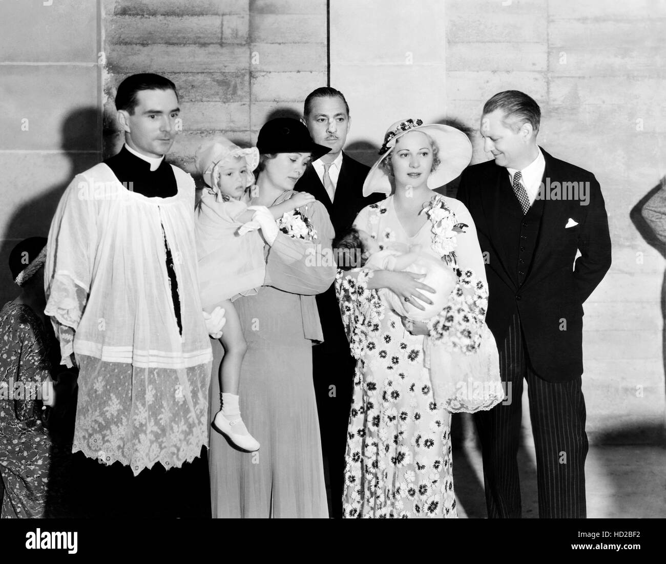 From left, priest, Dolores Costello, (holding DeDe Barrymore, her ...