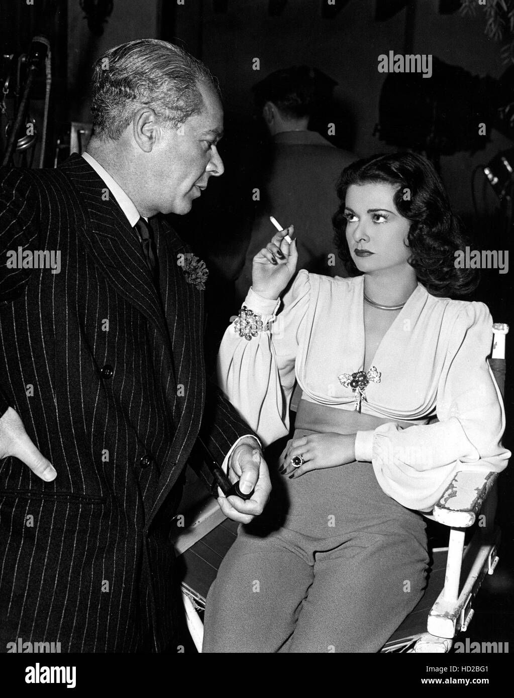 JOAN BENNETT, with husband producer Walter Wanger on the set of the ...