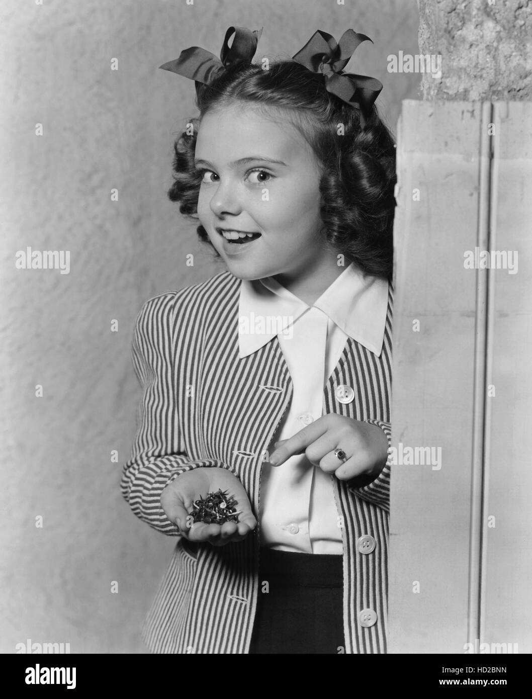 Joan Carroll preparing to play a prank on set of OBLIGING YOUNG LADY ...