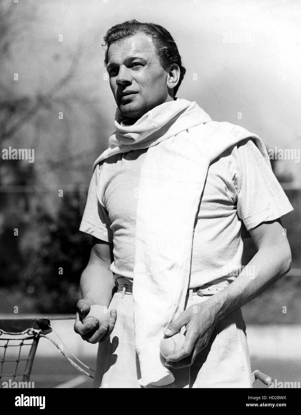 JOSEPH COTTEN relaxes by playing tennis, 1941 Stock Photo - Alamy