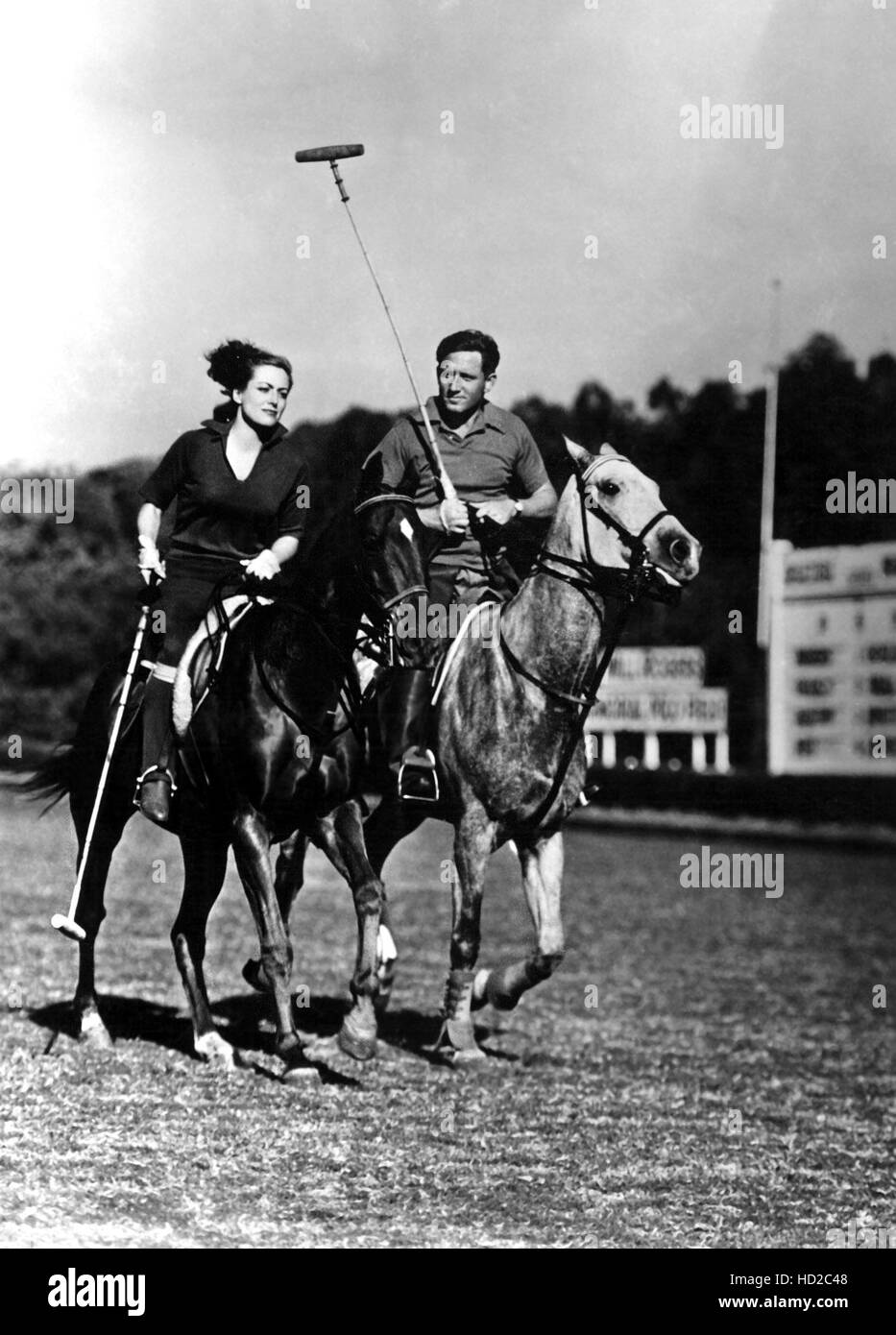 Joan Crawford and Spencer Tracy playing polo Stock Photo - Alamy