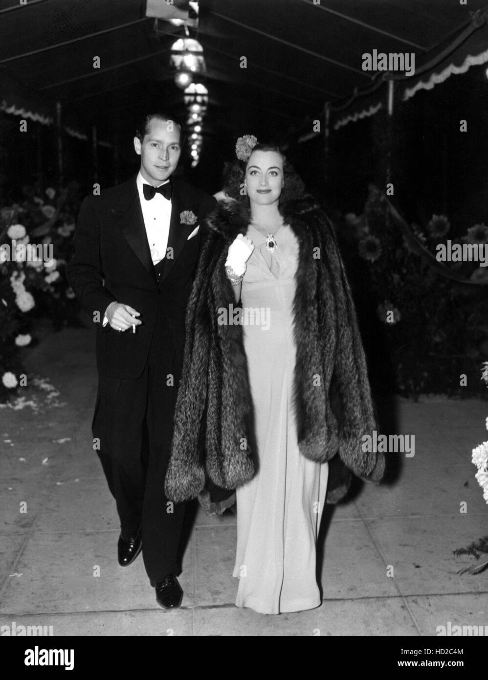 FRANCHOT TONE and wife JOAN CRAWFORD arrive at Hollywood premiere of ...