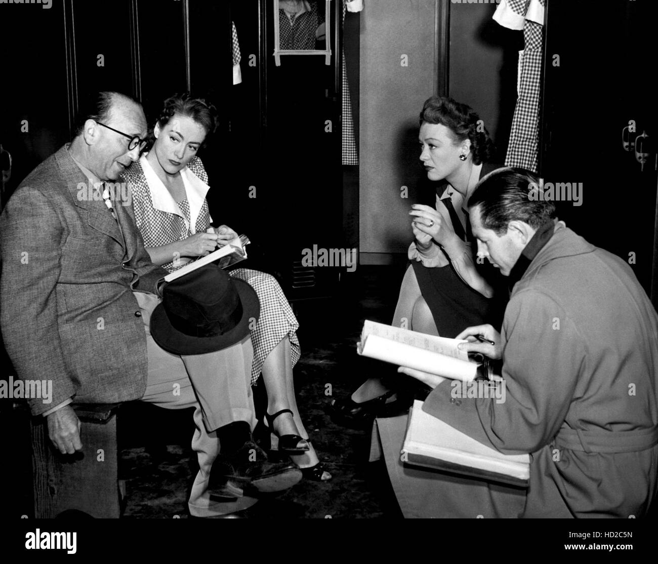Michael Curtiz, Joan Crawford, Eve Arden, Robert Shayne go over the ...