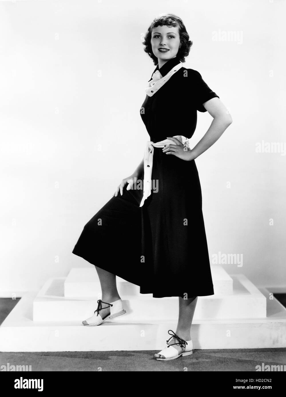 June Lang models navy blue flannel culottes with matching white wool ...