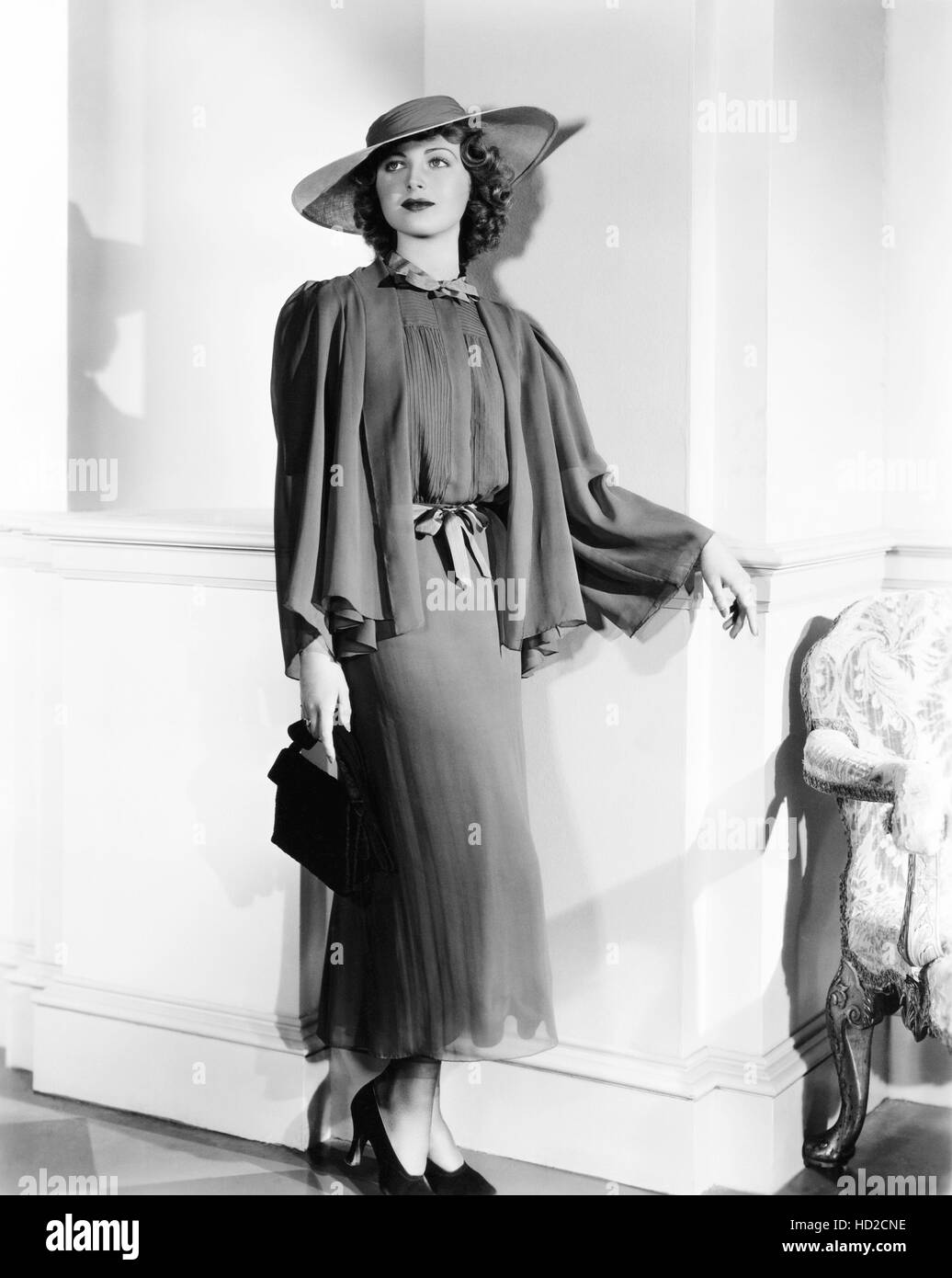 June Lang wears a chiffon ensemble with grosgrain ribbon detail, 1936 ...
