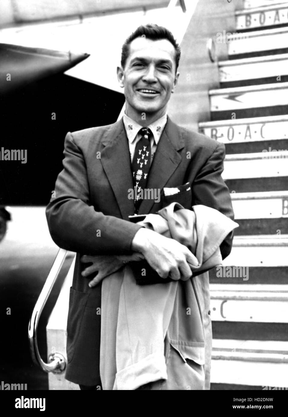 Kent Taylor arrives at airfield aboard BOAC, ca late 1940s Stock Photo ...