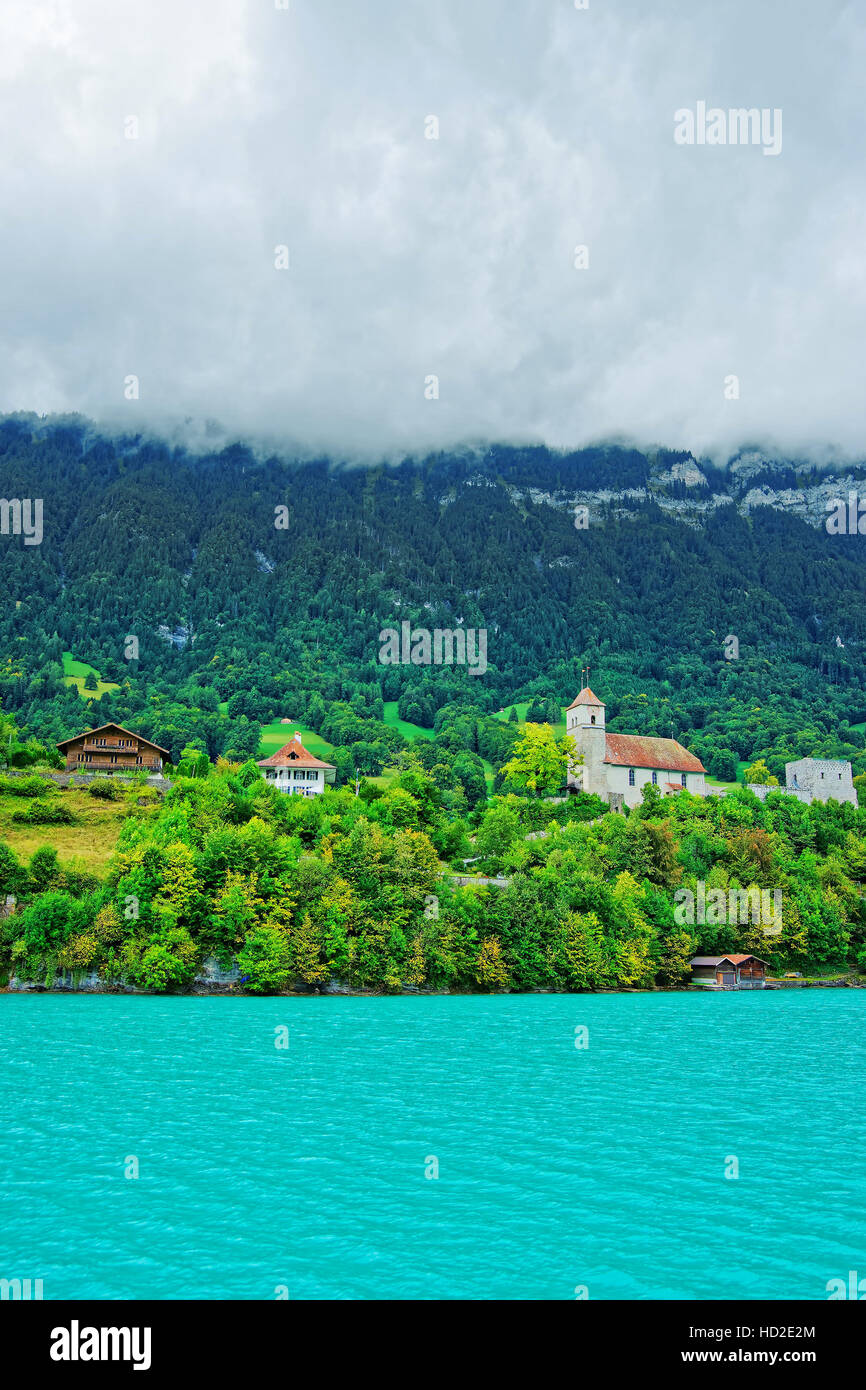 Parish Church at Brienz Lake and Brienzer Rothorn mountain at ...