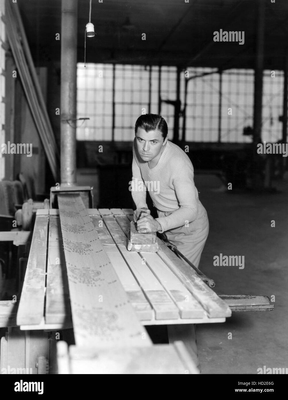 Lyle Talbot tinkering at Warner Brothers studio plaster shop, ca. 1932 ...