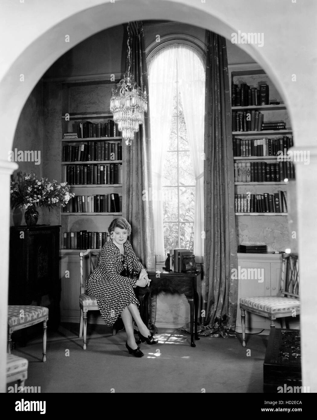Mary Boland relaxing in library at home, ca. 1934 Stock Photo - Alamy