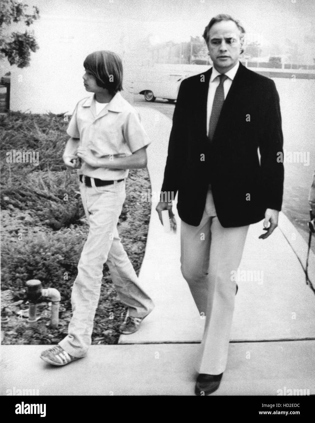 Marlon Brando, right, with his son, Christian Brando, en route to a ...