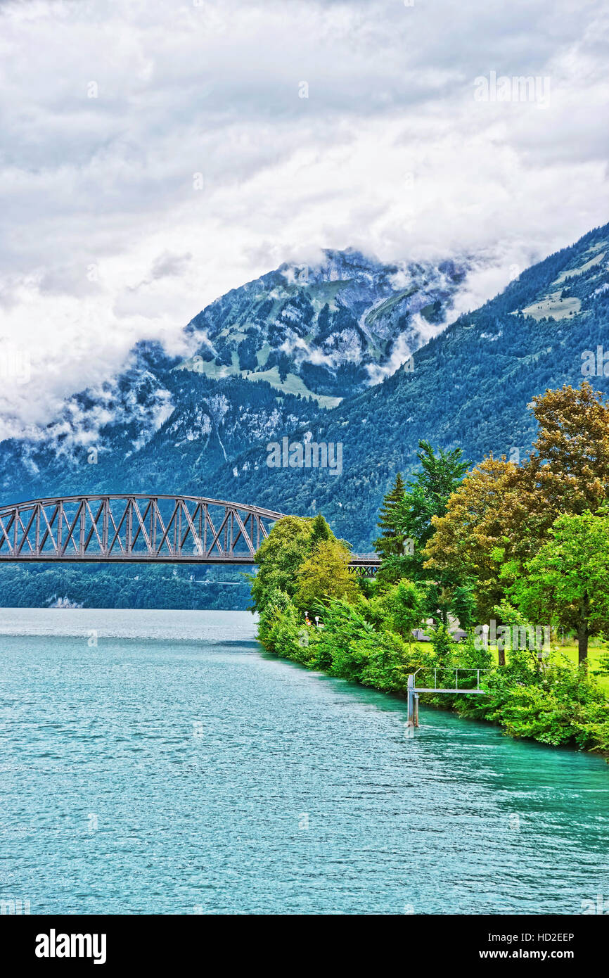 Bridge over Lake Brienz and Brienzer Rothorn mountain on the background ...