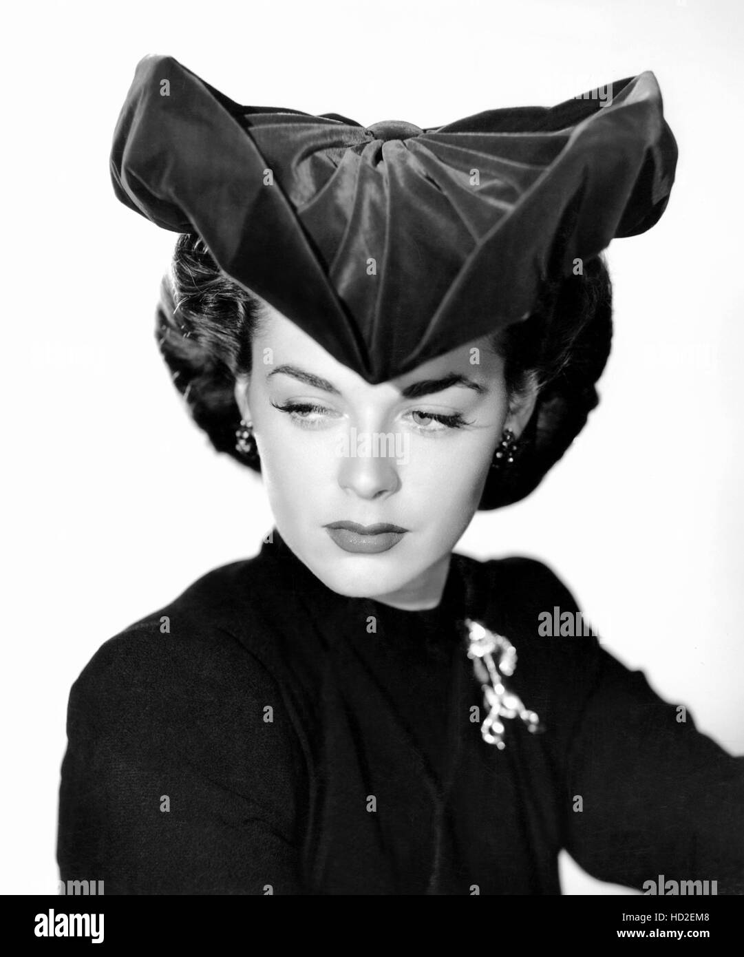 Marguerite Chapman, modeling an 'ultra chic miracle hat' that can be ...