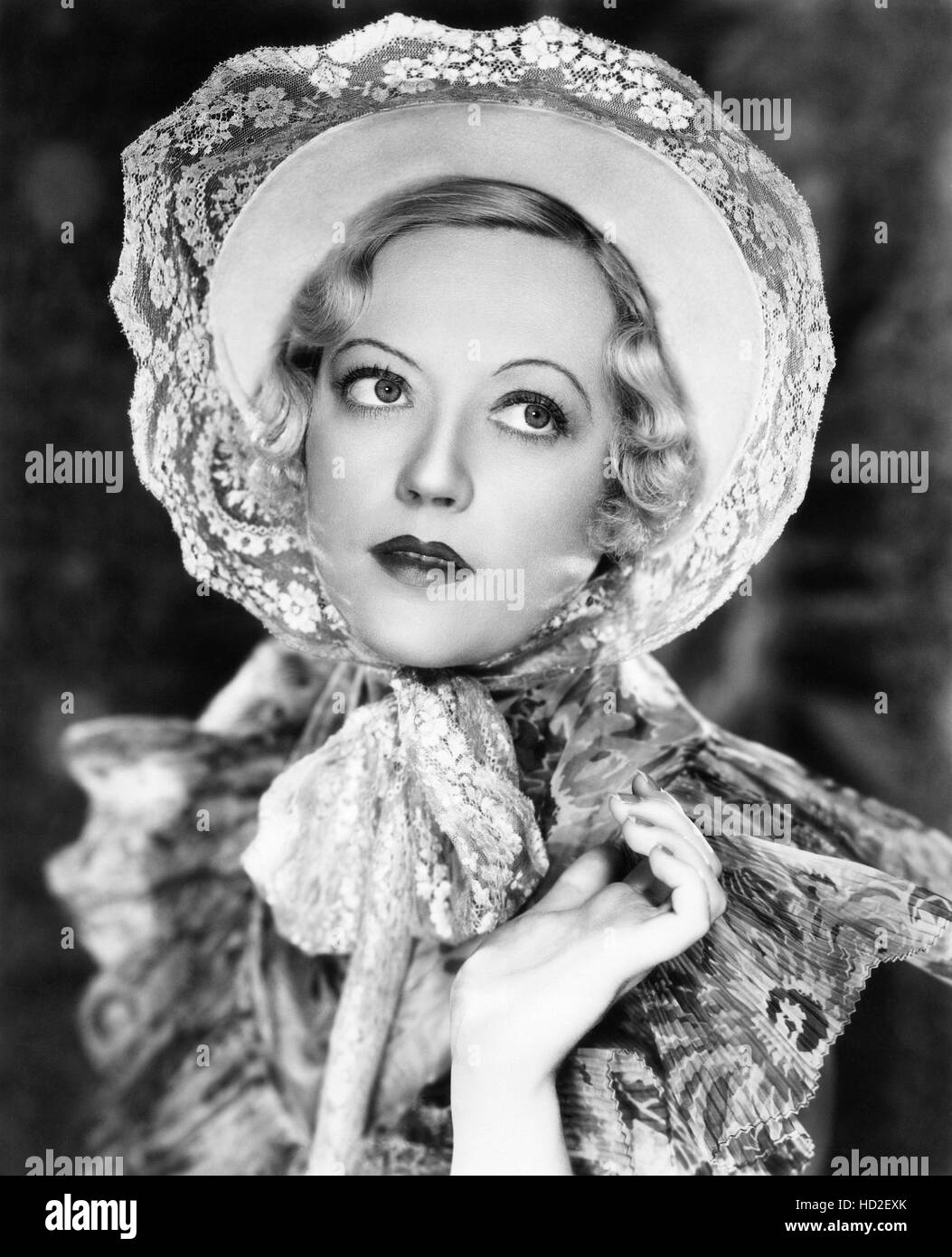 Marion Davies, modeling a poke bonnet of pink velvet trimmed with rose ...