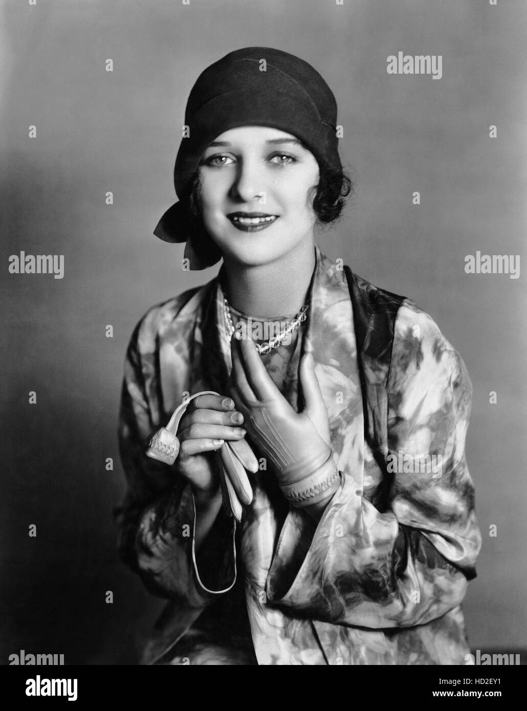 Marceline Day, modeling kid gloves with turned-back cuffs, ca. late ...