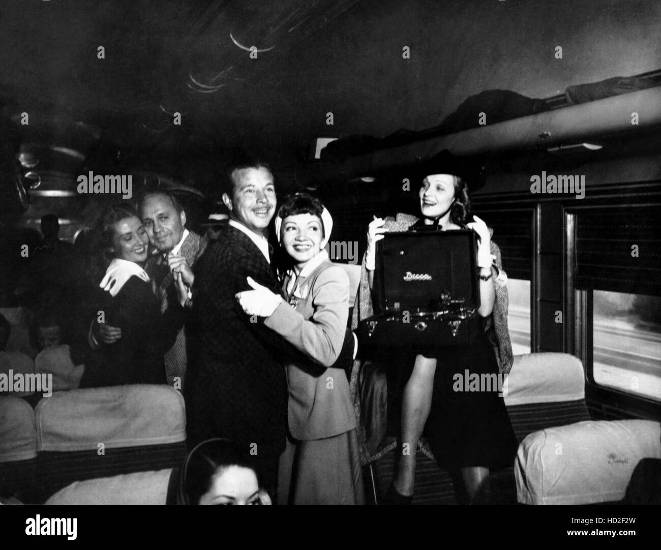 From left, Joan Blondell, Jack Benny, Dick Powell, Claudette Colbert ...
