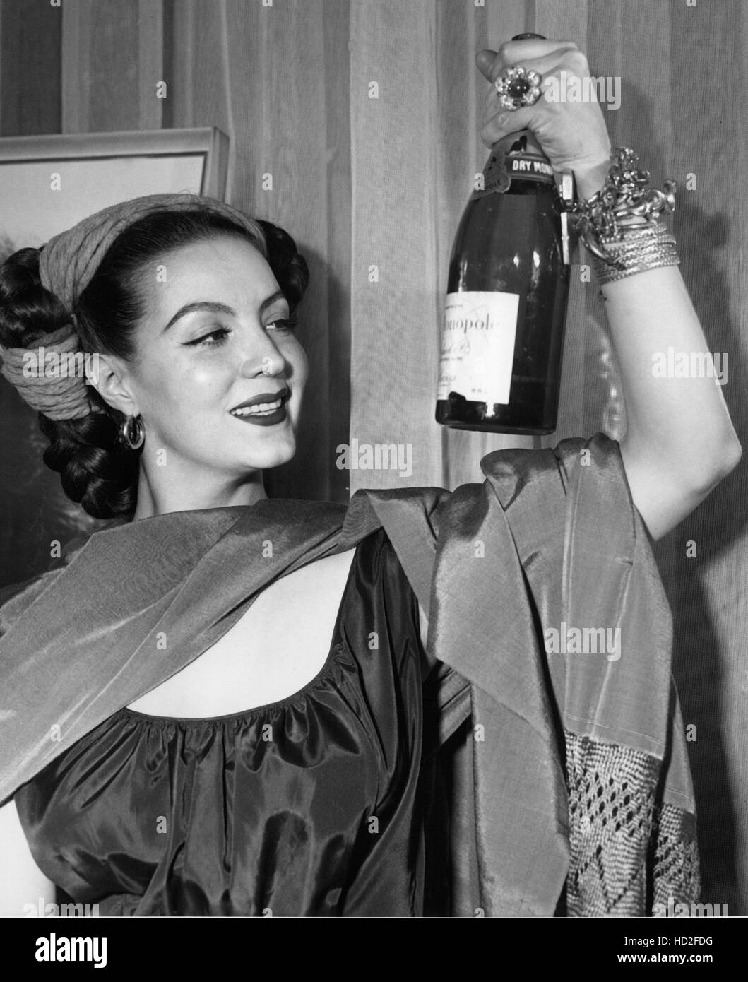 MARIA FELIX, enjoys a bottle of champagne, during a visit to Paris ...