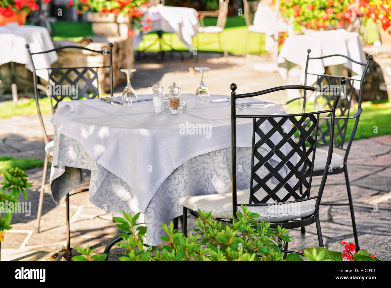 Typical restaurant terrace with chairs and tables ready for a meal at ...