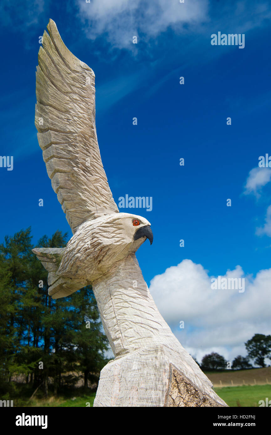 A carved wooden red kite in flight sculpture at Tynrhyd Wedding venue ...