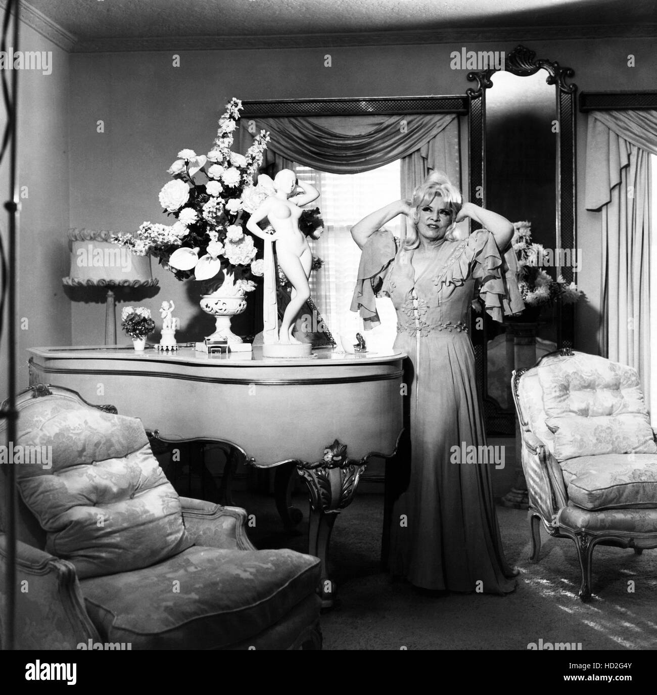 Mae West, in her apartment at the Ravenswood in Hollywood, ca. late ...