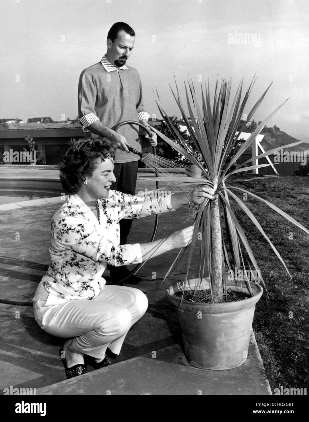 Front to back: Mercedes McCambridge at home gardening with husband ...