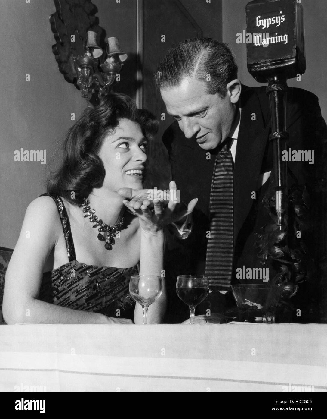 THE GYPSY AND THE GENTLEMAN, Melina Mercouri reading the palm of ...