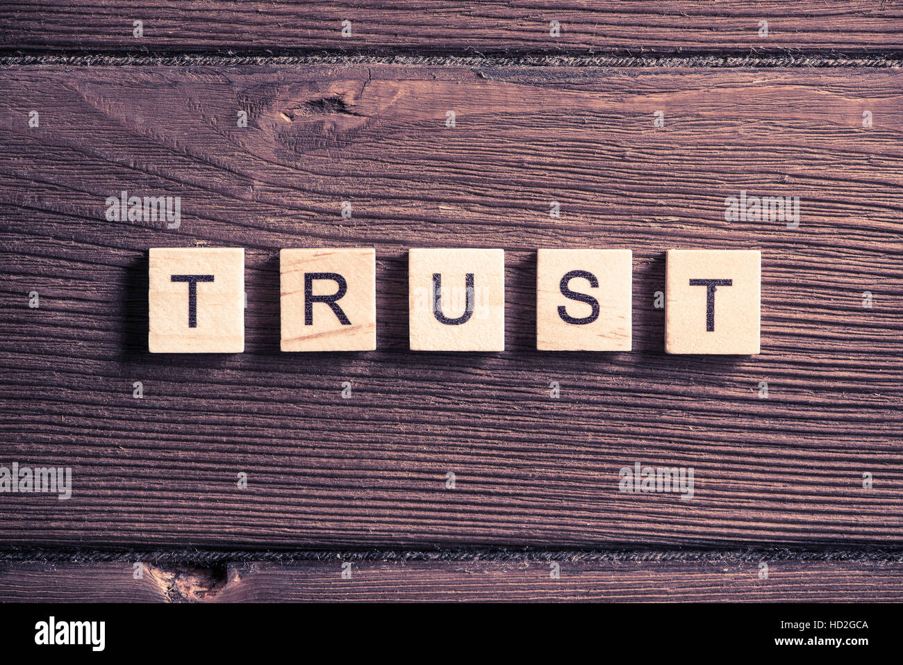 Trust word of wooden elements Stock Photo - Alamy