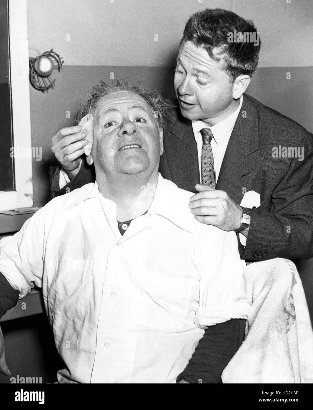 Mickey Rooney applying theatrical makeup to his father Joe Yule, 1948 ...