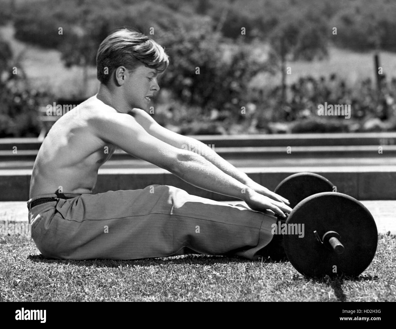 Mickey Rooney doing his daily weight lifting exercises on his new ranch ...