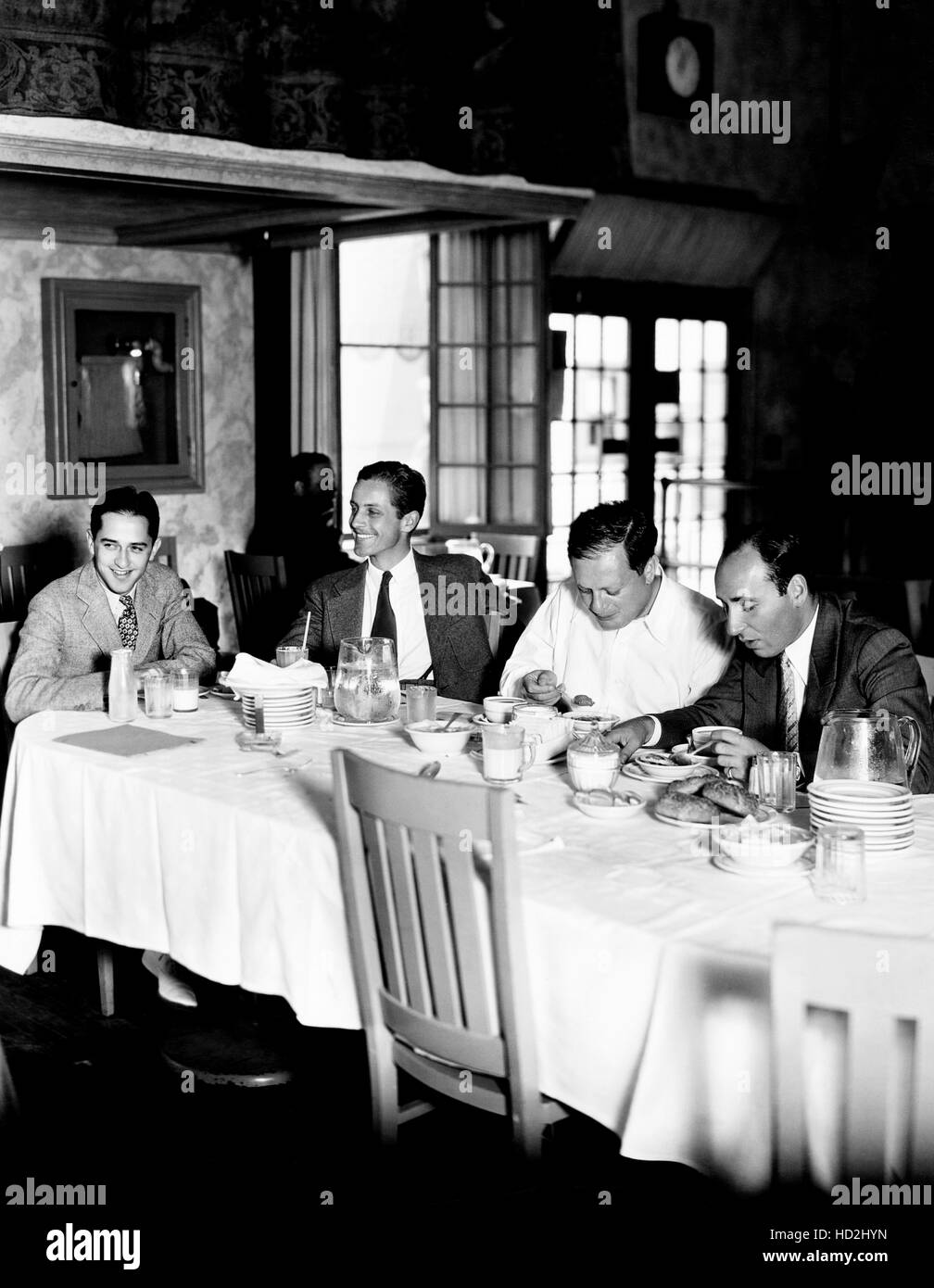 Phillips Holmes 9second from left) dining at the Paramount cafe with ...