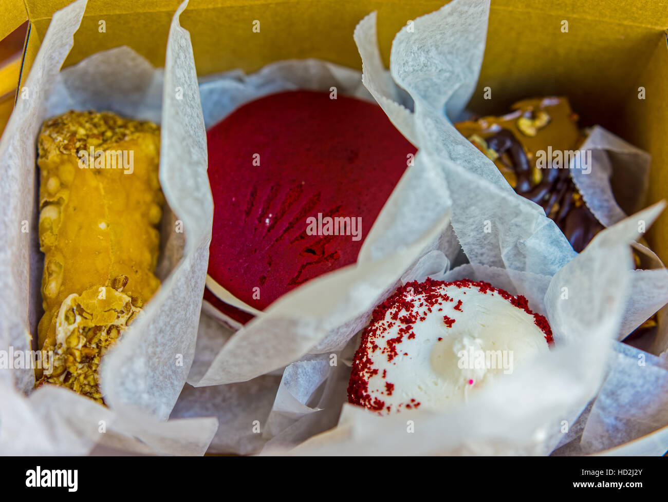 Mix of colorful and tasty sweets in a box Stock Photo - Alamy