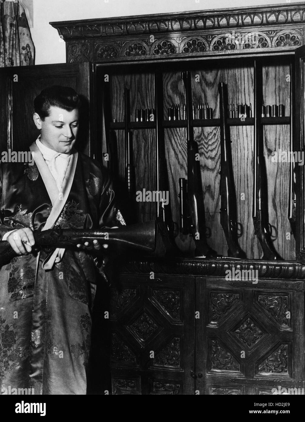 Ralph Forbes, with his gun collection, 1933 Stock Photo - Alamy