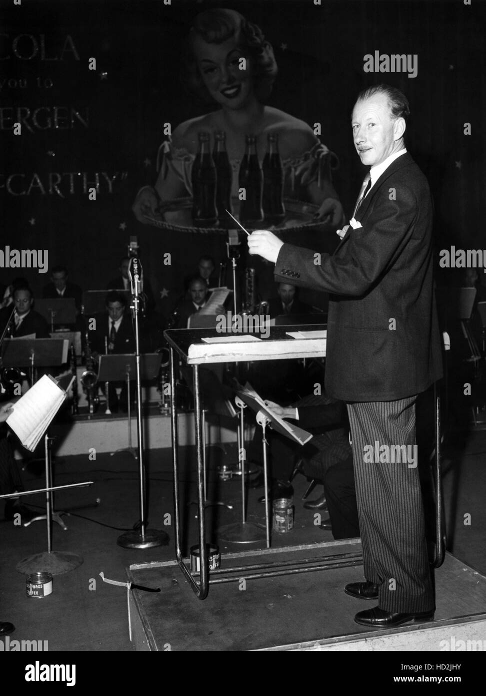 Ray Noble rehearsing his orchestra, ca. 1940s Stock Photo - Alamy