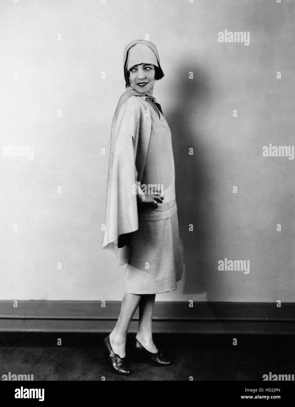 Renee Adoree, in a gray and green crepe dress with matching cape, 1928 ...