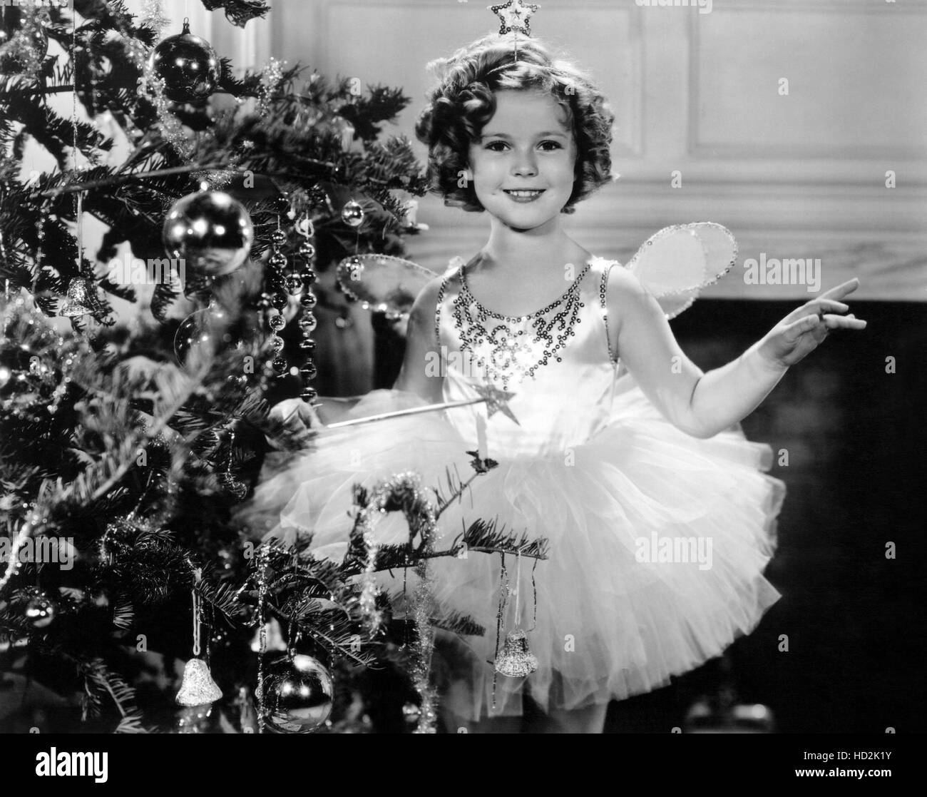 Shirley Temple at Christmas time, wearing a tutu, angel wings and a ...